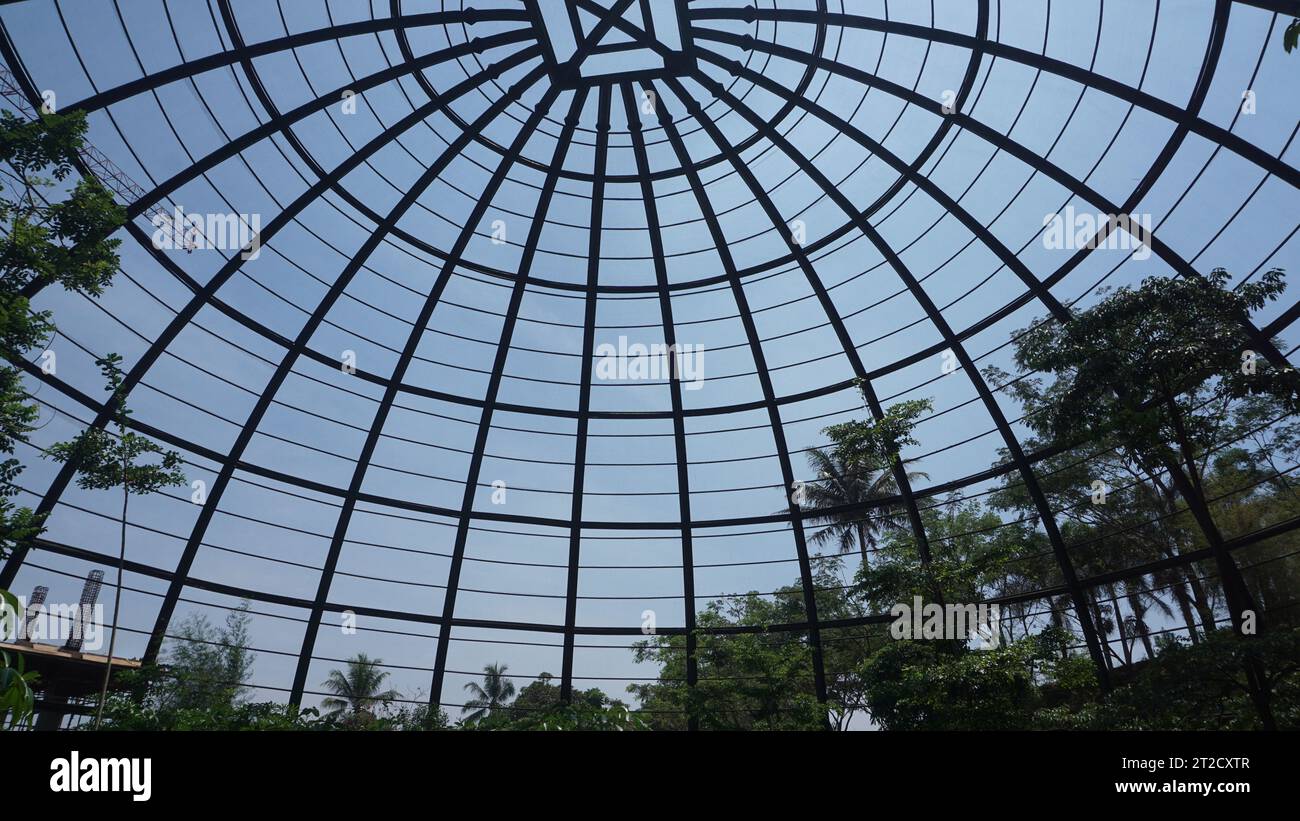 view inside a large aviary dome with curved steel in the form of dome ...