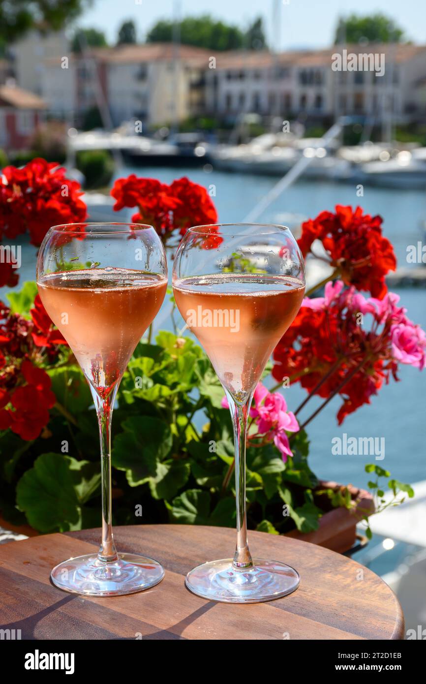 Summer party, drinking of French brut rose champagne sparkling wine in ...