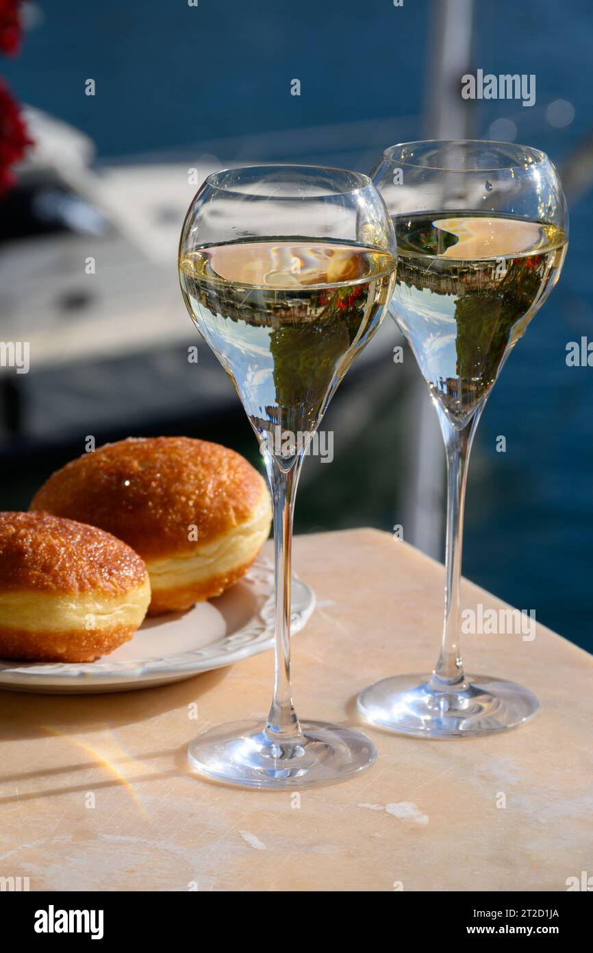 Drinking of French brut champagne sparkling wine with sweet apple ...