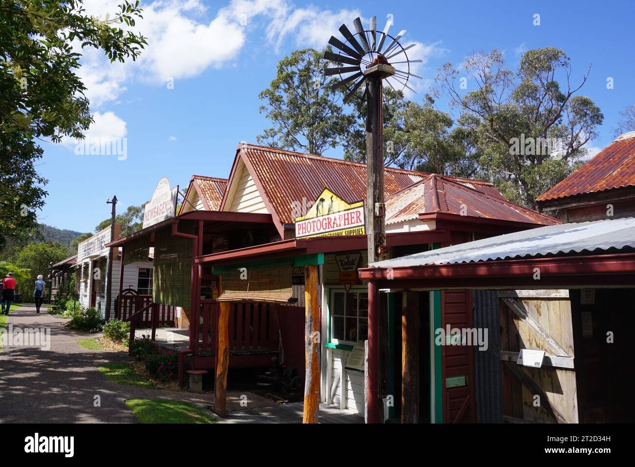 Street with old buildings and weathervane in historical village outdoor ...