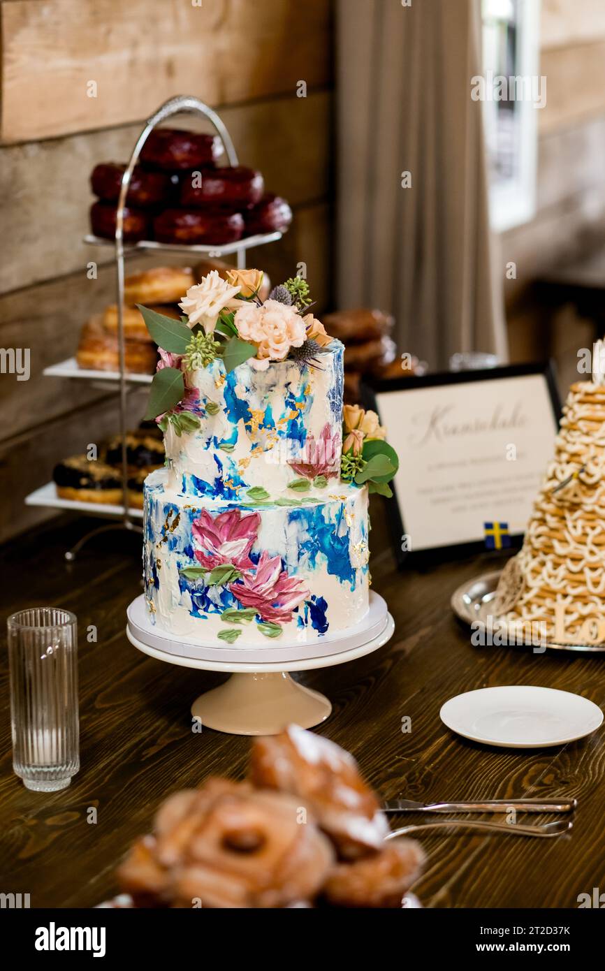 Colorful Wedding Cake at Indoor Reception Stock Photo - Alamy