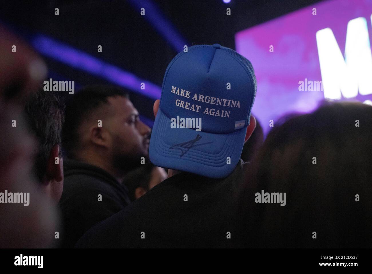 A supporter of Javier Milei wears a "Make Argentina Great Again" hat ...
