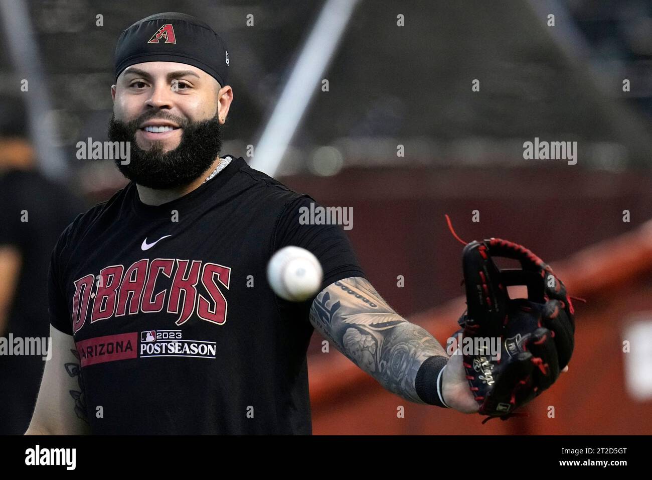 Arizona Diamondbacks third baseman Emmanuel Rivera reaches out to catch ...