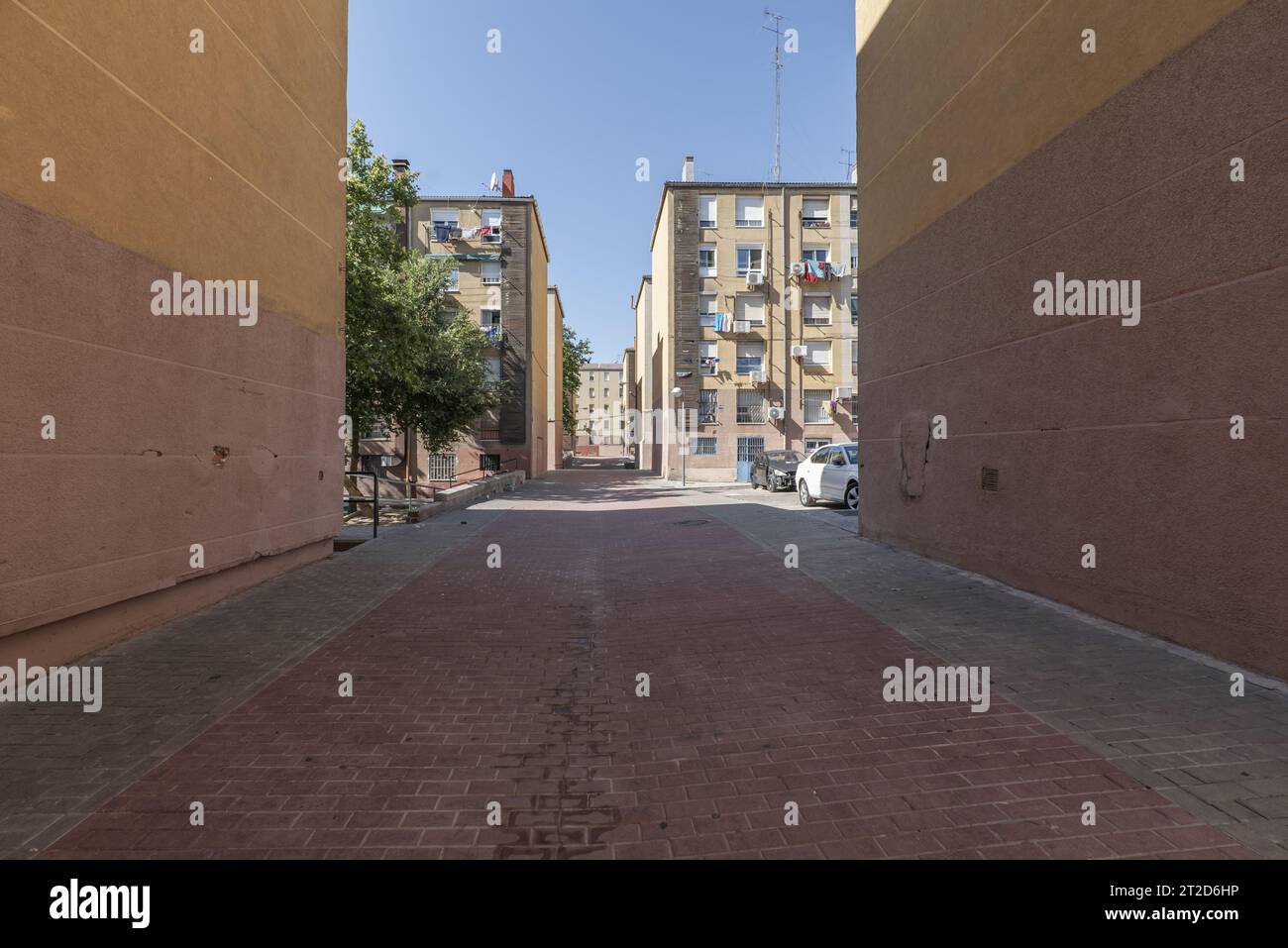 Pedestrian walk between buildings of a residential housing colony built ...