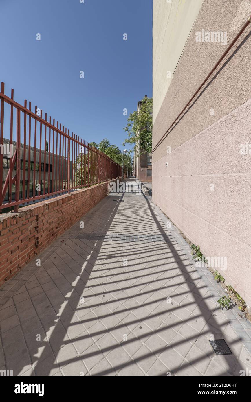 Pedestrian walk between buildings of a residential housing colony built ...