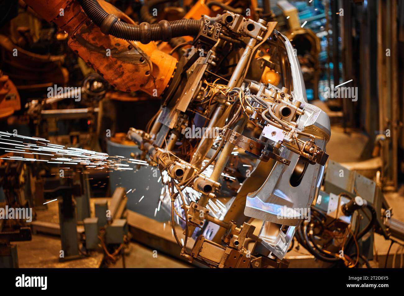 Modern robot welder processes metal part in factory workshop Stock ...