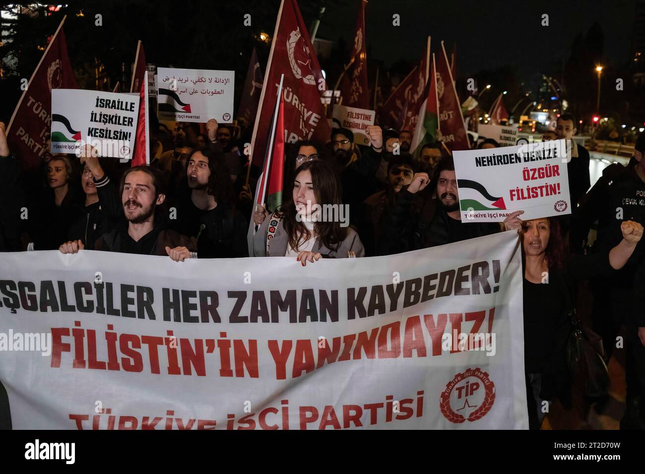 Ankara, Turkey. 18th Oct, 2023. Protesters march with a banner and ...