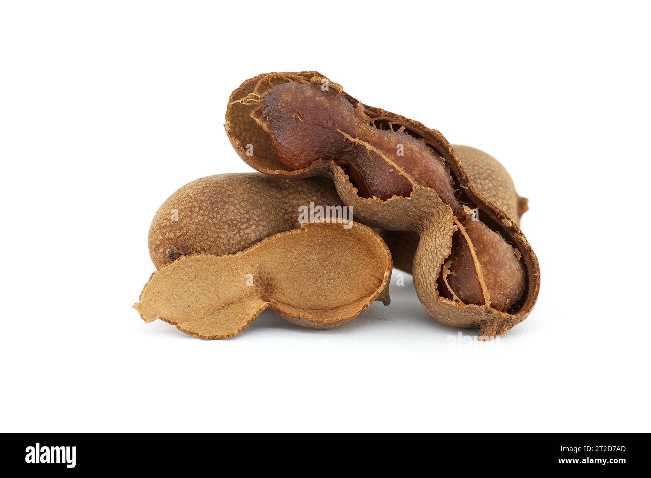 Tamarind fruits, whole and cracked open isolated on white background ...