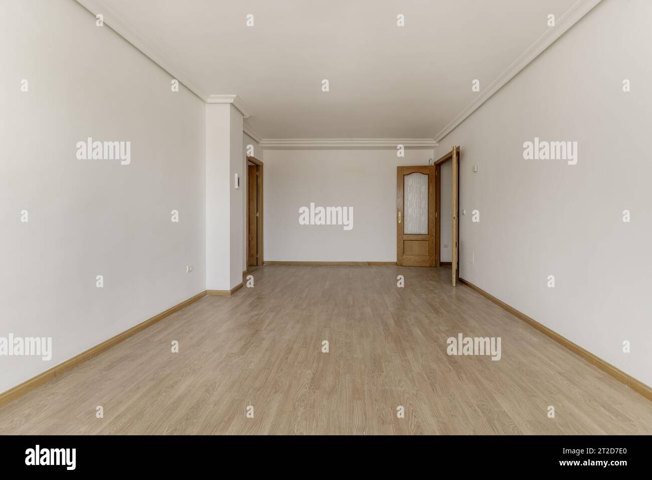 Empty living room of a single-family house with doors to other rooms ...