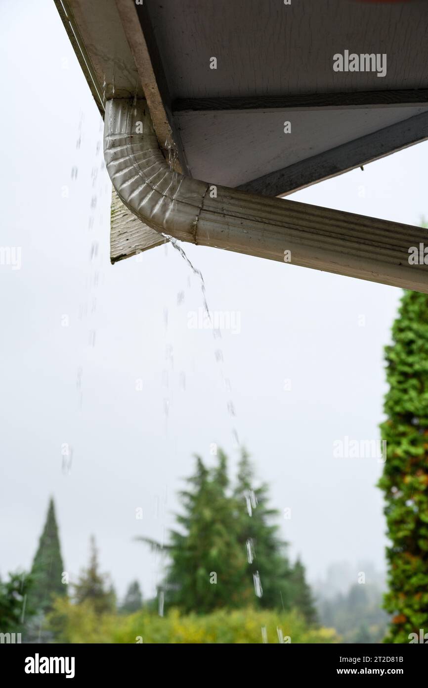 Heavy rainfall overflowing roof gutter and not going down the downspout ...
