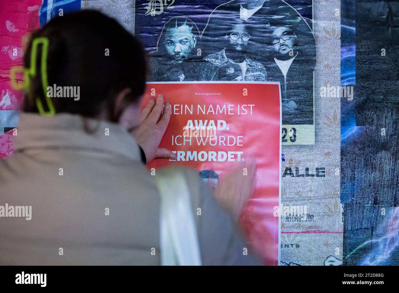 18 October 2023, Berlin: A participant of a poster campaign of the ...