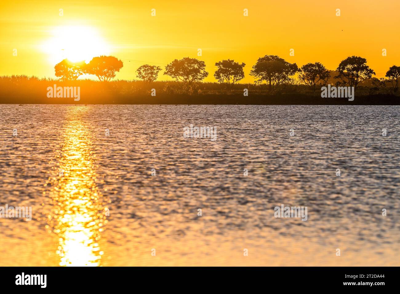 Fantastic sunset over Plantation Creek near Ayr in the Shire of Burdekin, Queensland Stock Photo ...