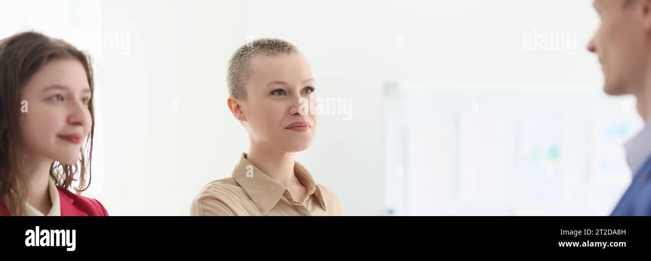 Happy manager watches colleagues shaking hands in office Stock Photo ...