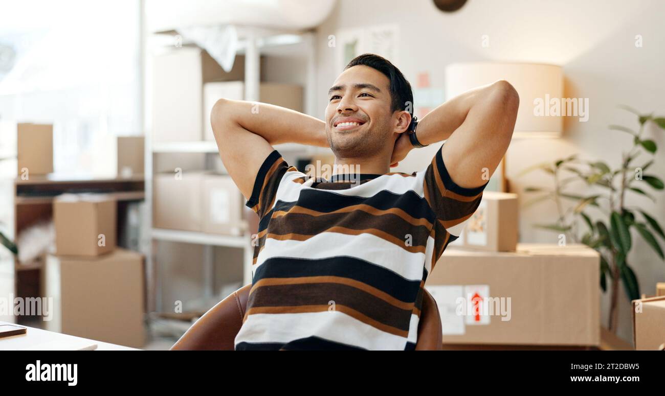 Happy man, smile and relax in satisfaction in office at logistics ...