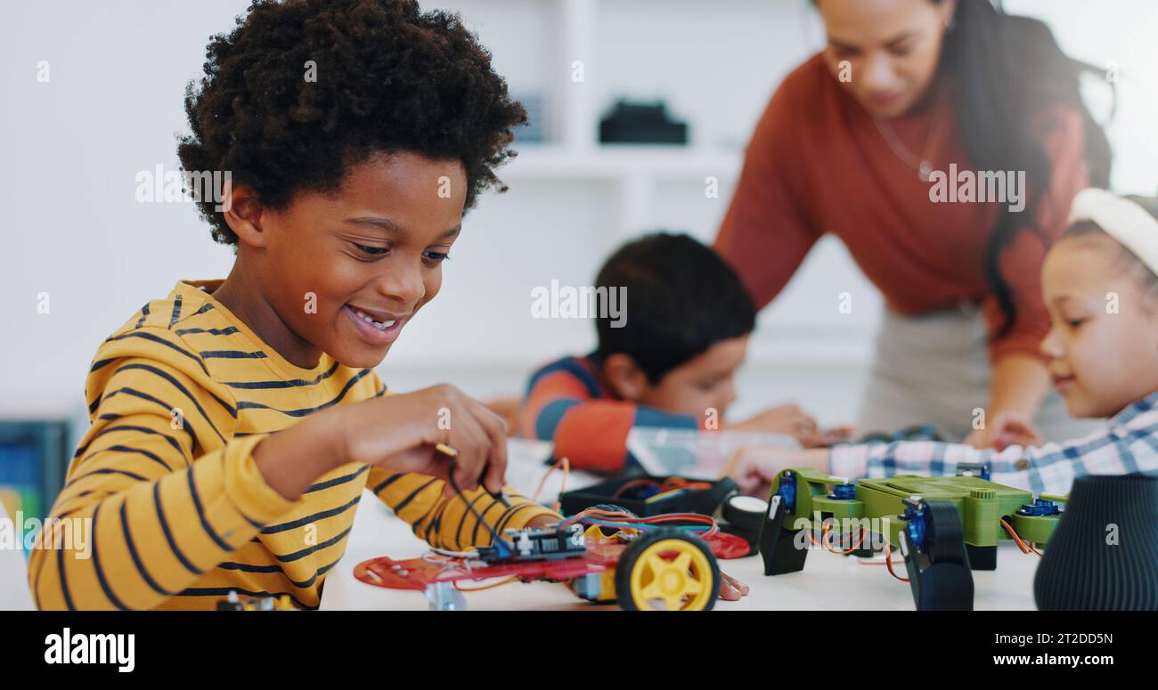 Technology, boy and car robotics in classroom for learning, education ...