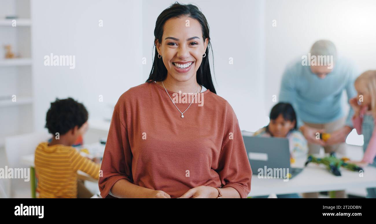 Portrait, woman and happy teacher in classroom at kindergarten for ...