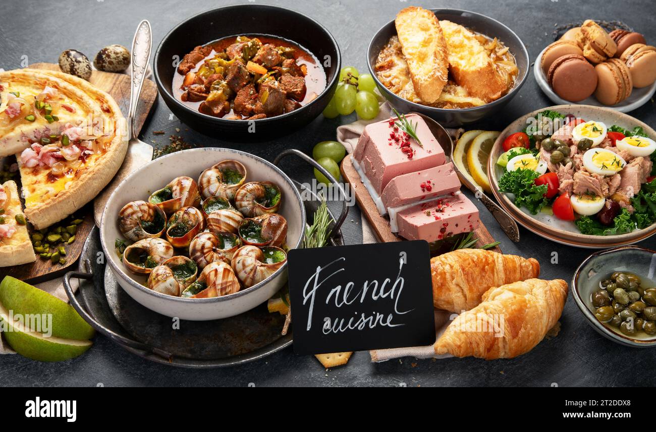 French food assortment on dark background. Traditional cuisine concept ...
