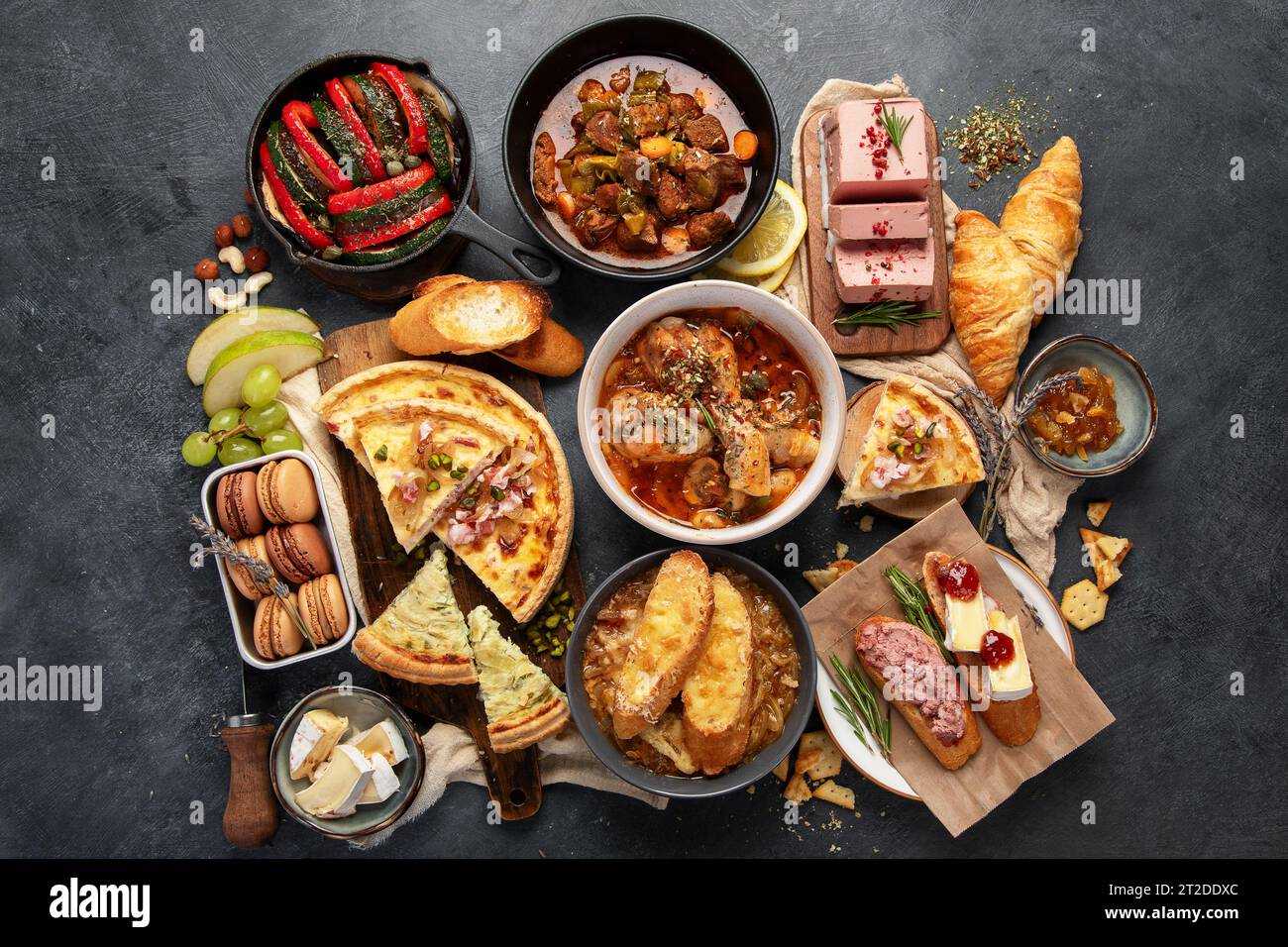 French food assortment on dark background. Traditional cuisine concept ...