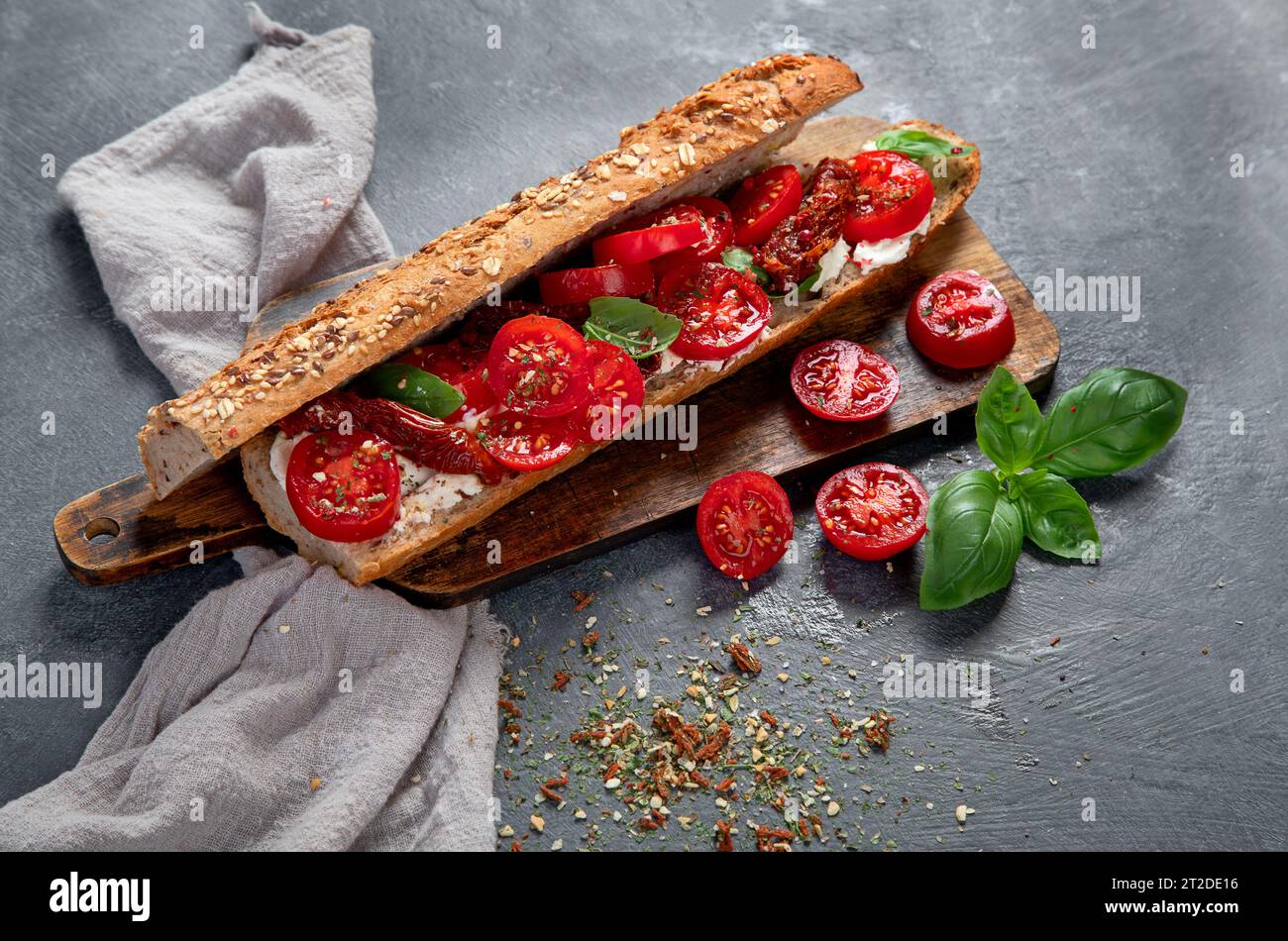 Fresh baguette with Caprese. Delicious sandwich with with tomatoes and mozzarella cheese with ...