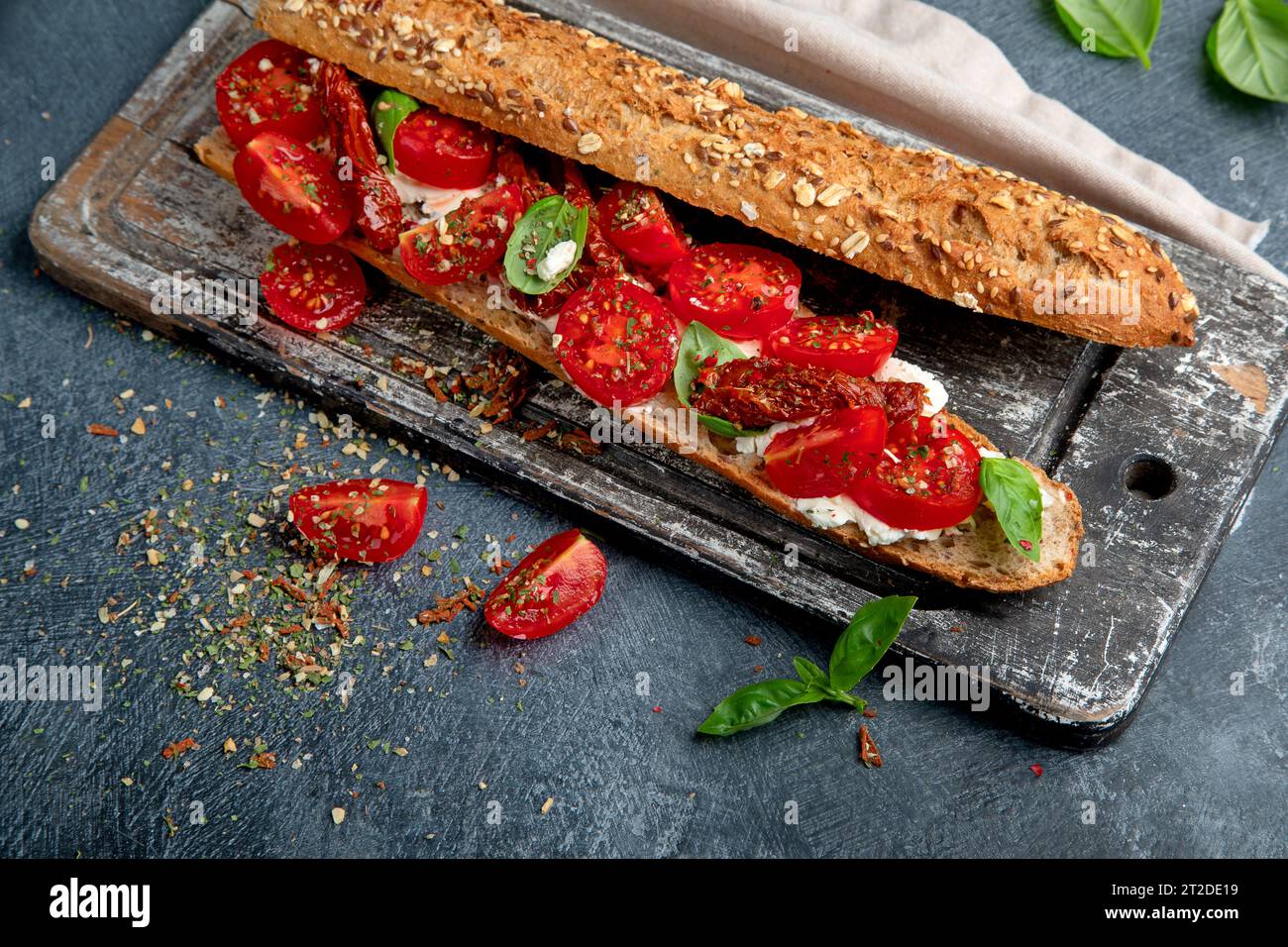 Fresh baguette with Caprese. Delicious sandwich with with tomatoes and mozzarella cheese with ...