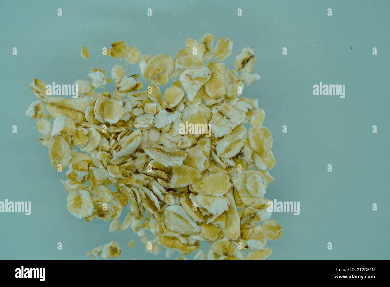 Oatmeal is a whole grain cereal product made from seed oats Stock Photo ...