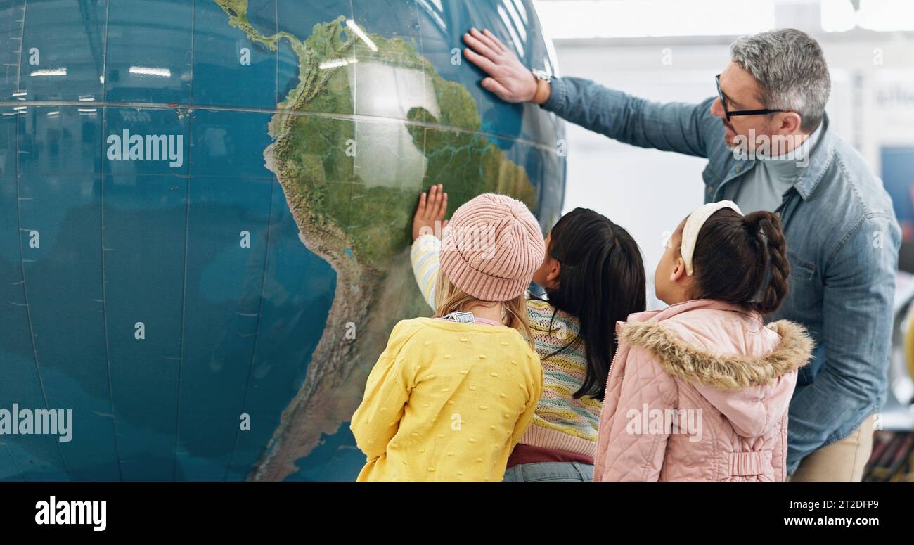 Young man teaching geography hi-res stock photography and images - Alamy