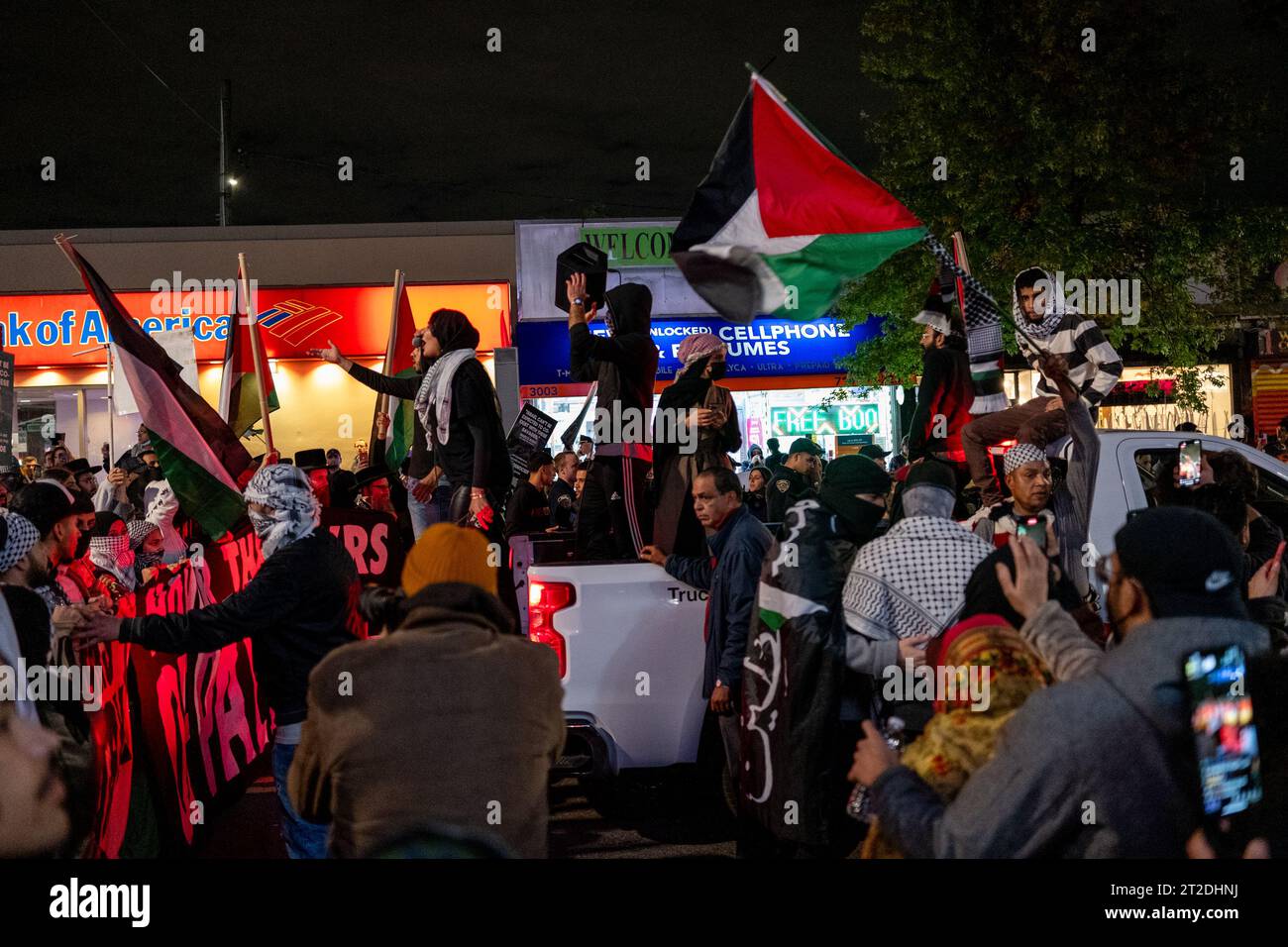 People attend a march in support of Palestine in Astoria, New York on ...