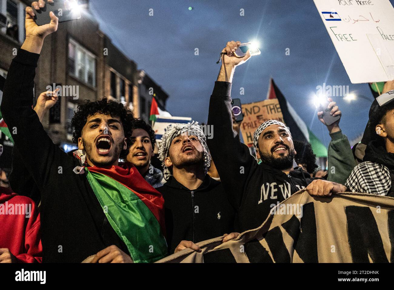 People attend a march in support of Palestine in Astoria, New York on ...