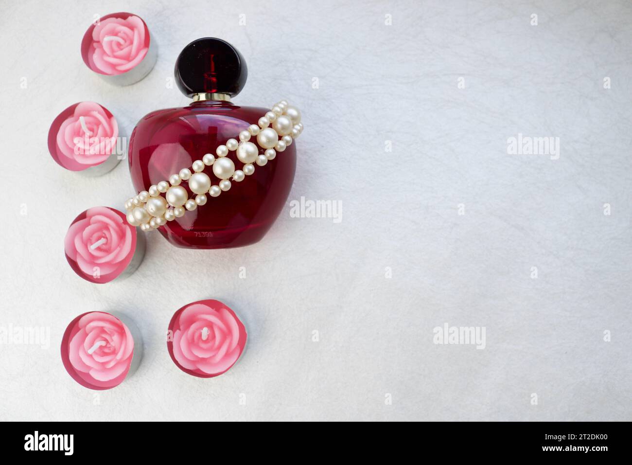 Violet beautiful glass transparent bottle of female perfume decorated ...