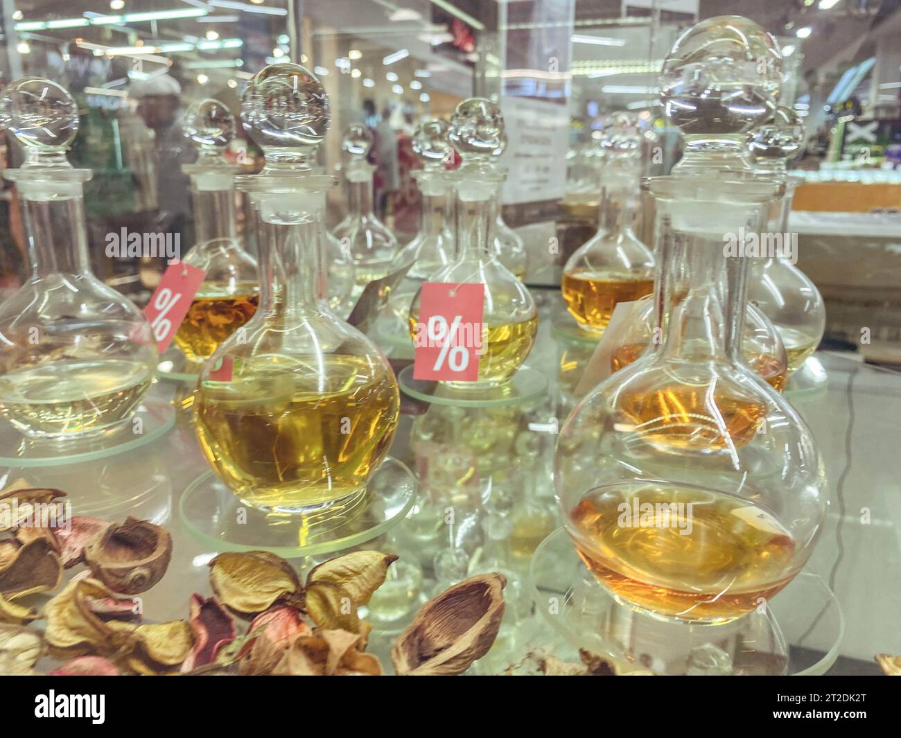 perfumes in transparent flasks. mixture of aromas, perfume essence ...