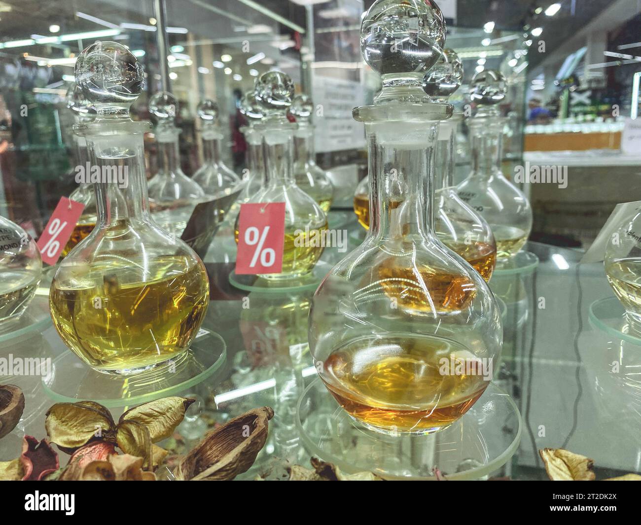 decorated transparent glass display case with perfume. perfumes in ...