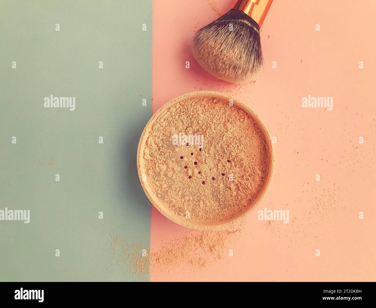 Overhead close up of one open jar of spilled pink blush powder Stock ...