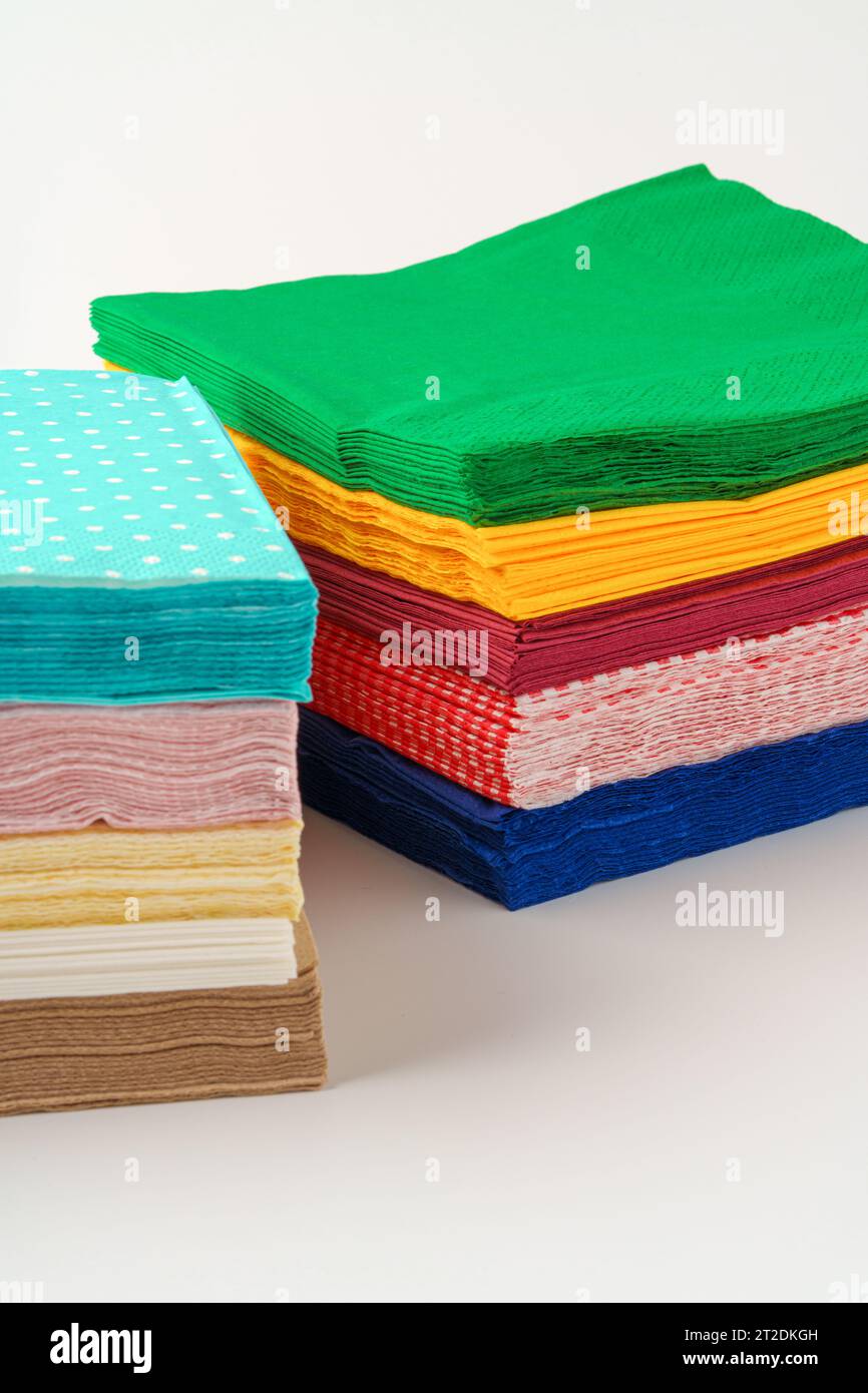 Two stacks of colorful paper napkins on white background Stock Photo ...