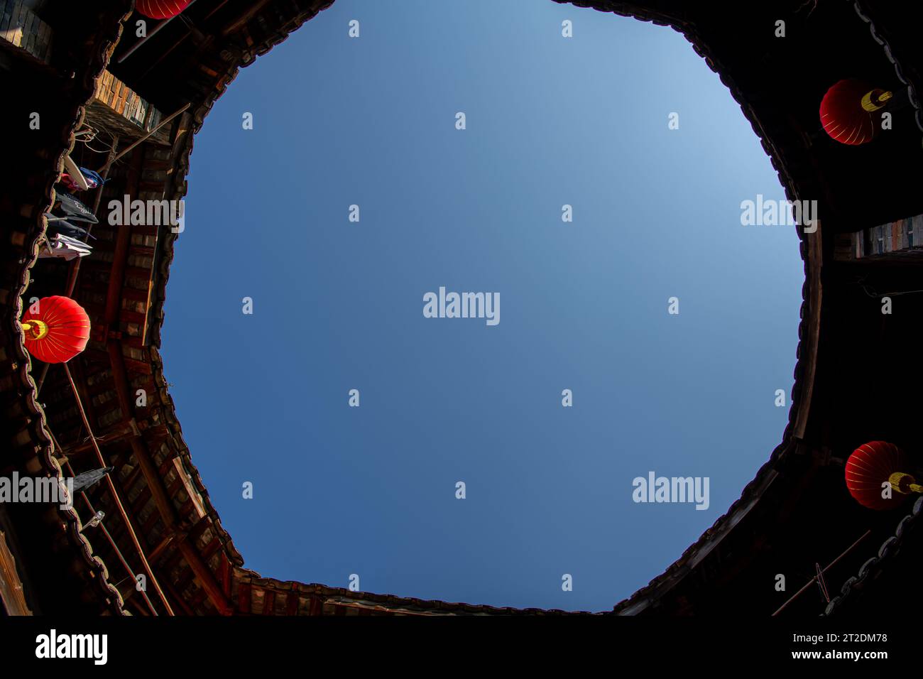 The sky aboce the round buildings of Hekeng Tulou Cluster in the early ...