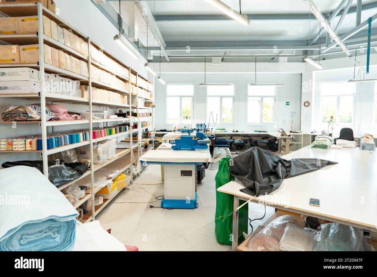 Interior of a sewing warehouse of furniture factory with equipment and ...