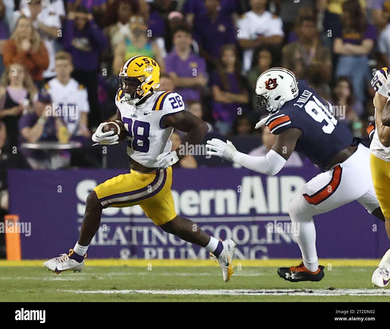 LSU Tigers running back Kaleb Jackson (28) tries to run past Auburn ...