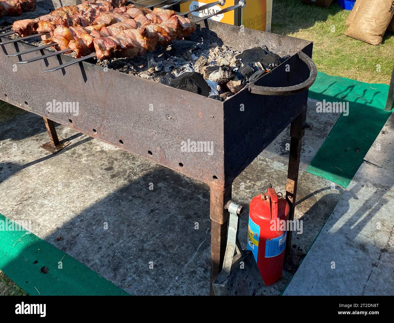 A large iron barbecue and grill barbecue outdoors at the open air at a ...