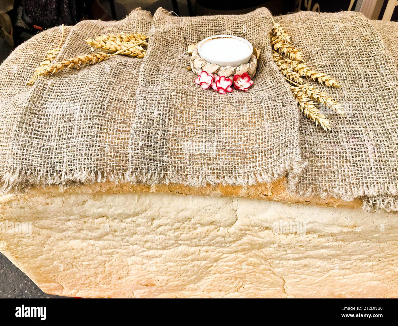 A large, huge rectangular loaf of white homemade, homemade wheat bread ...