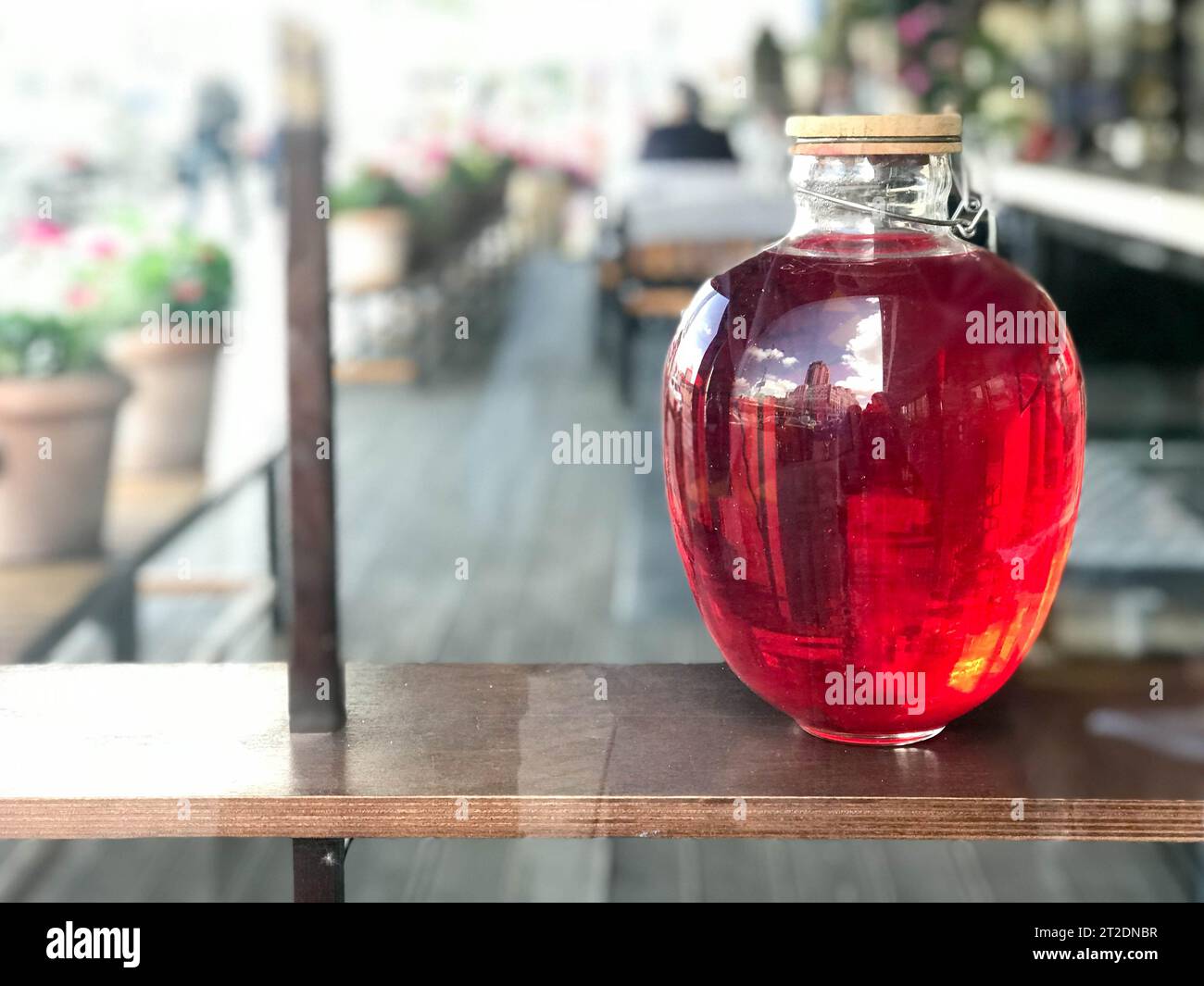 A large glass three-liter can of campote, juice, potions with a glowing ...