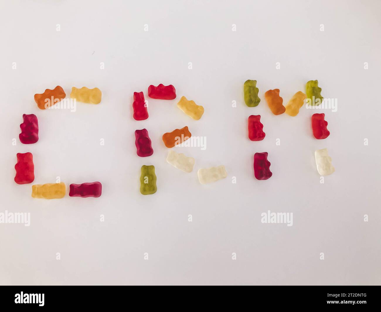 word from gummy gummy bears. edible letters C, R, M. vitamin word ...