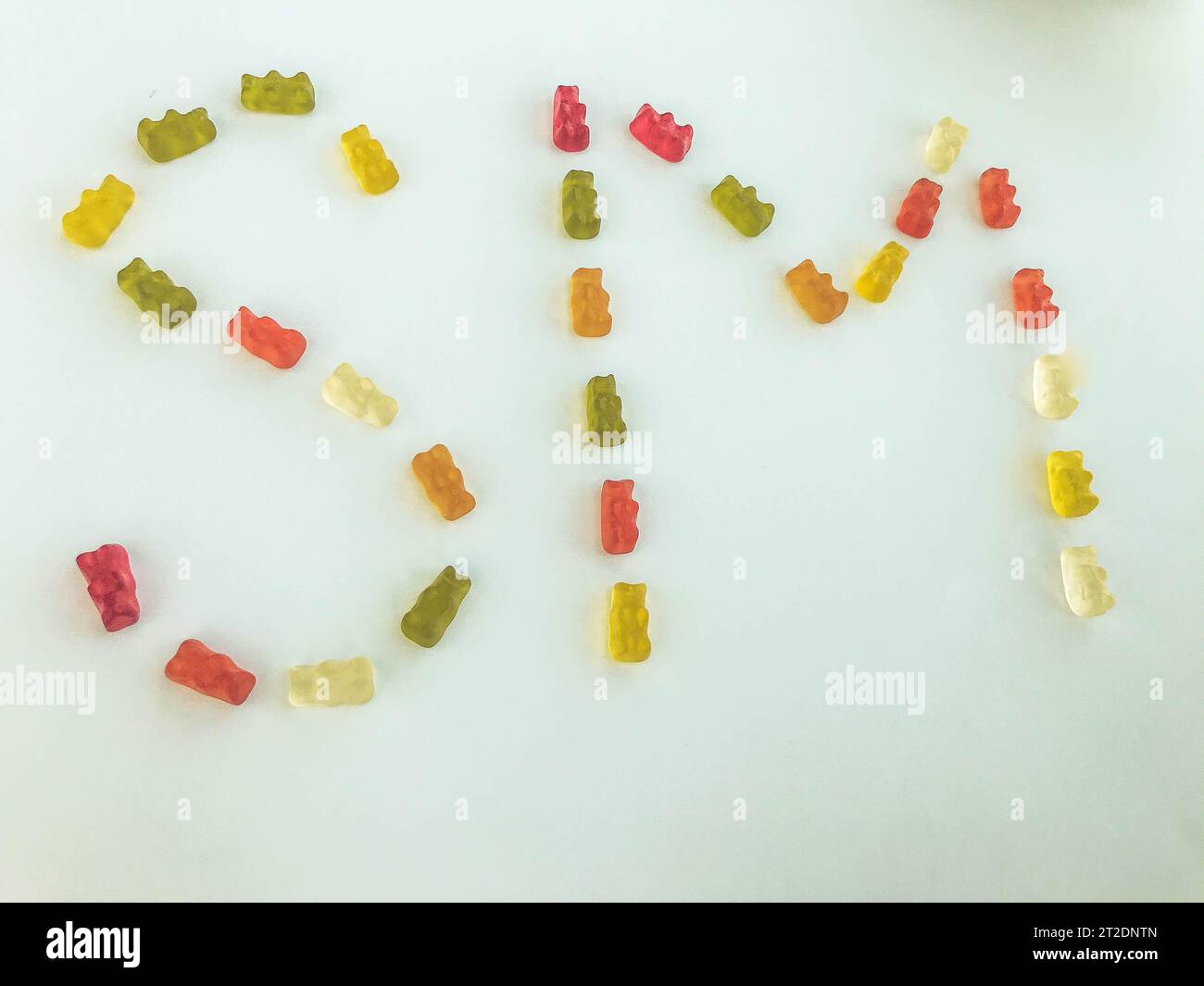 letter from multi-colored gummy bears. Letter S and M made from ...