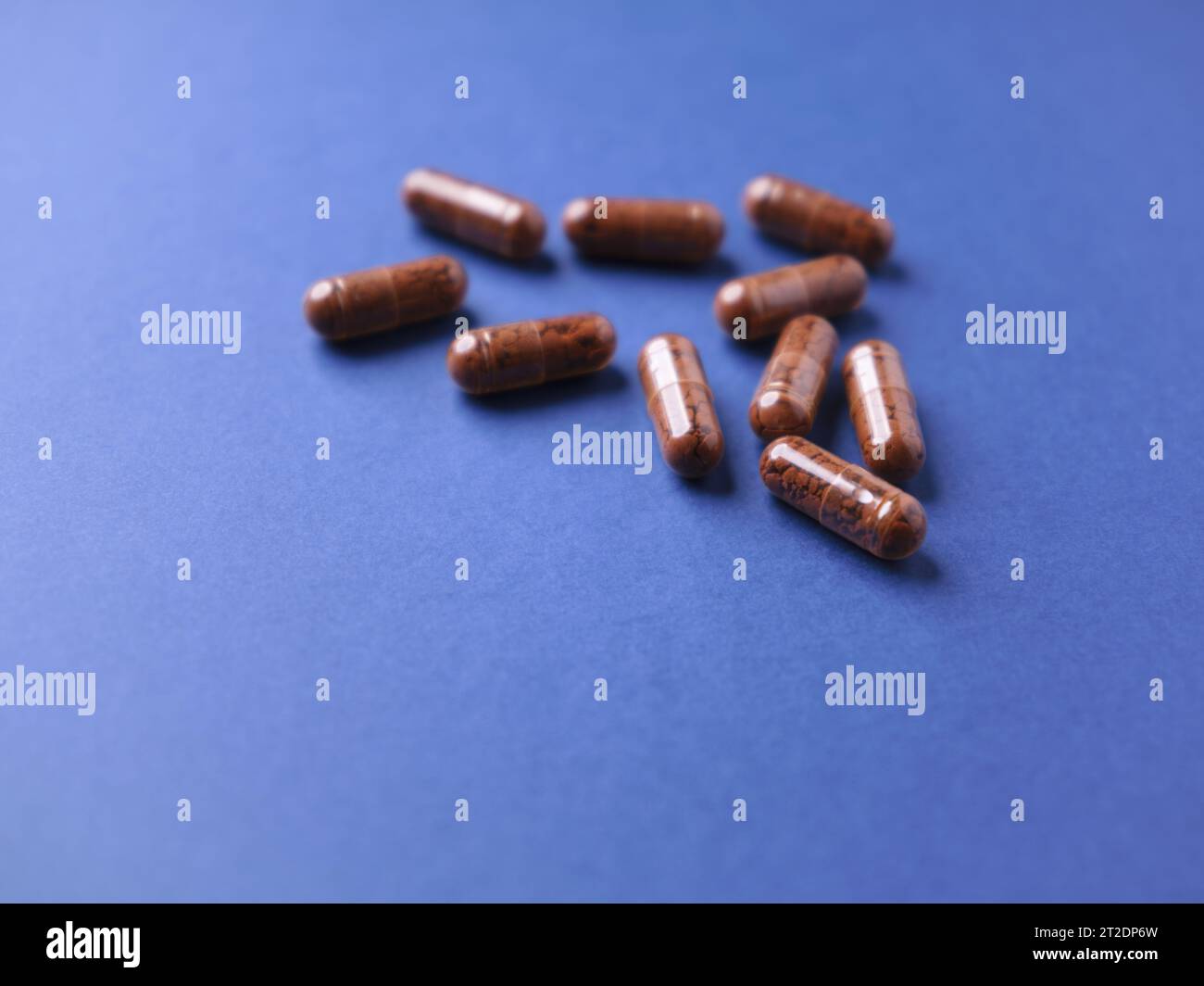 Ashwagandha (Withania somnifera) capsules. Paper background. Soft focus ...