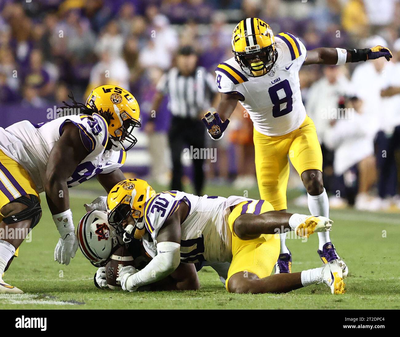 Both Auburn Tigers offensive lineman Jaden Muskrat (63) and LSU Tigers ...