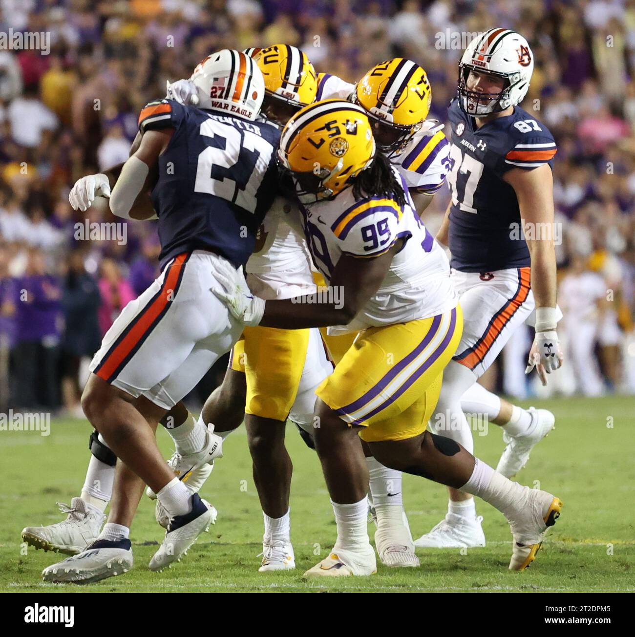 Auburn Tigers running back Jarquez Hunter (27) is tackled by a host of ...