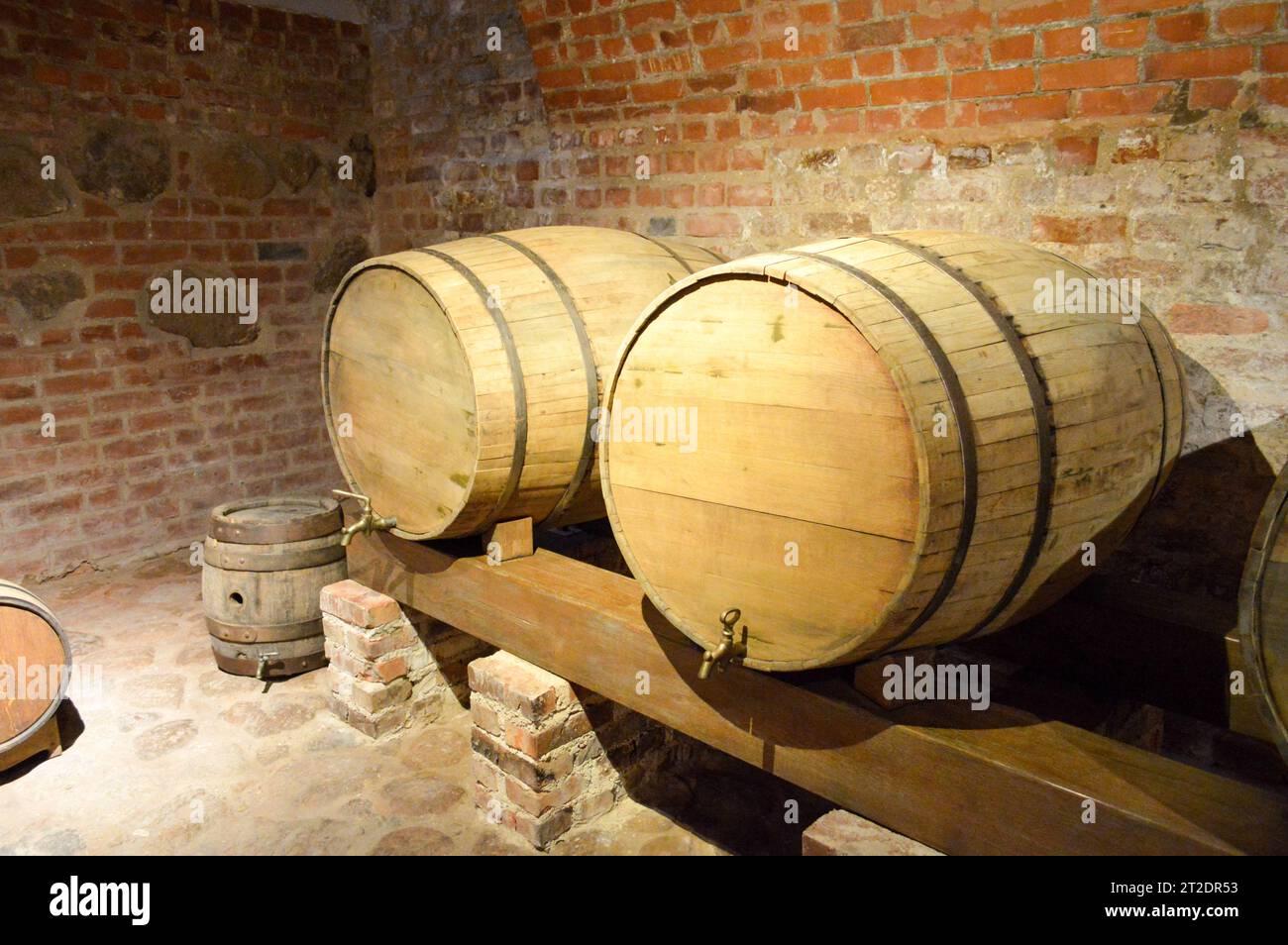 Large round wooden barrels for beer, wine in the old cellar of the ...