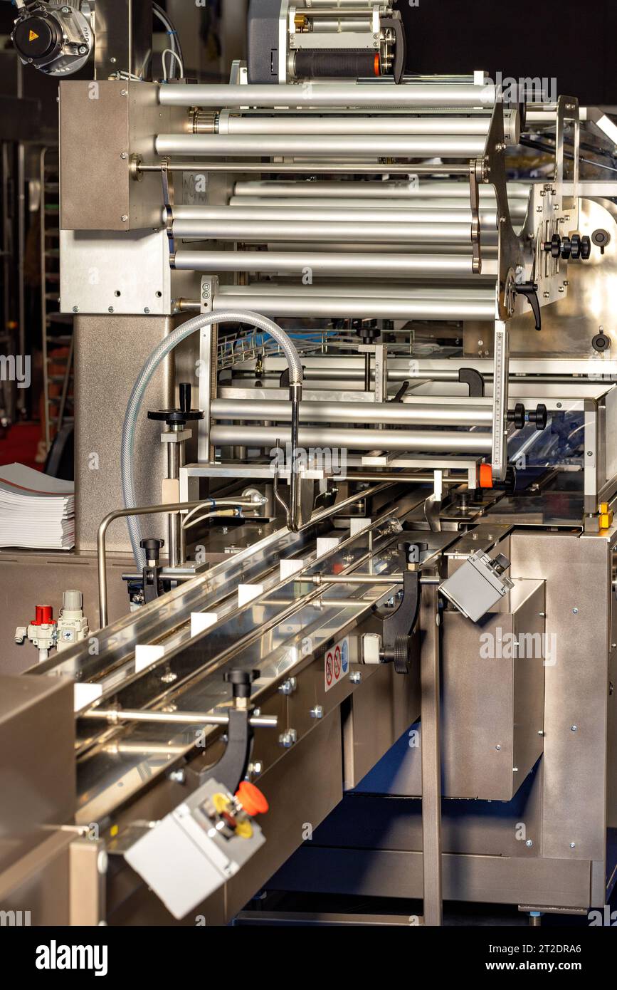 Automatic packaging conveyor line on food fabric, vertical image Stock ...