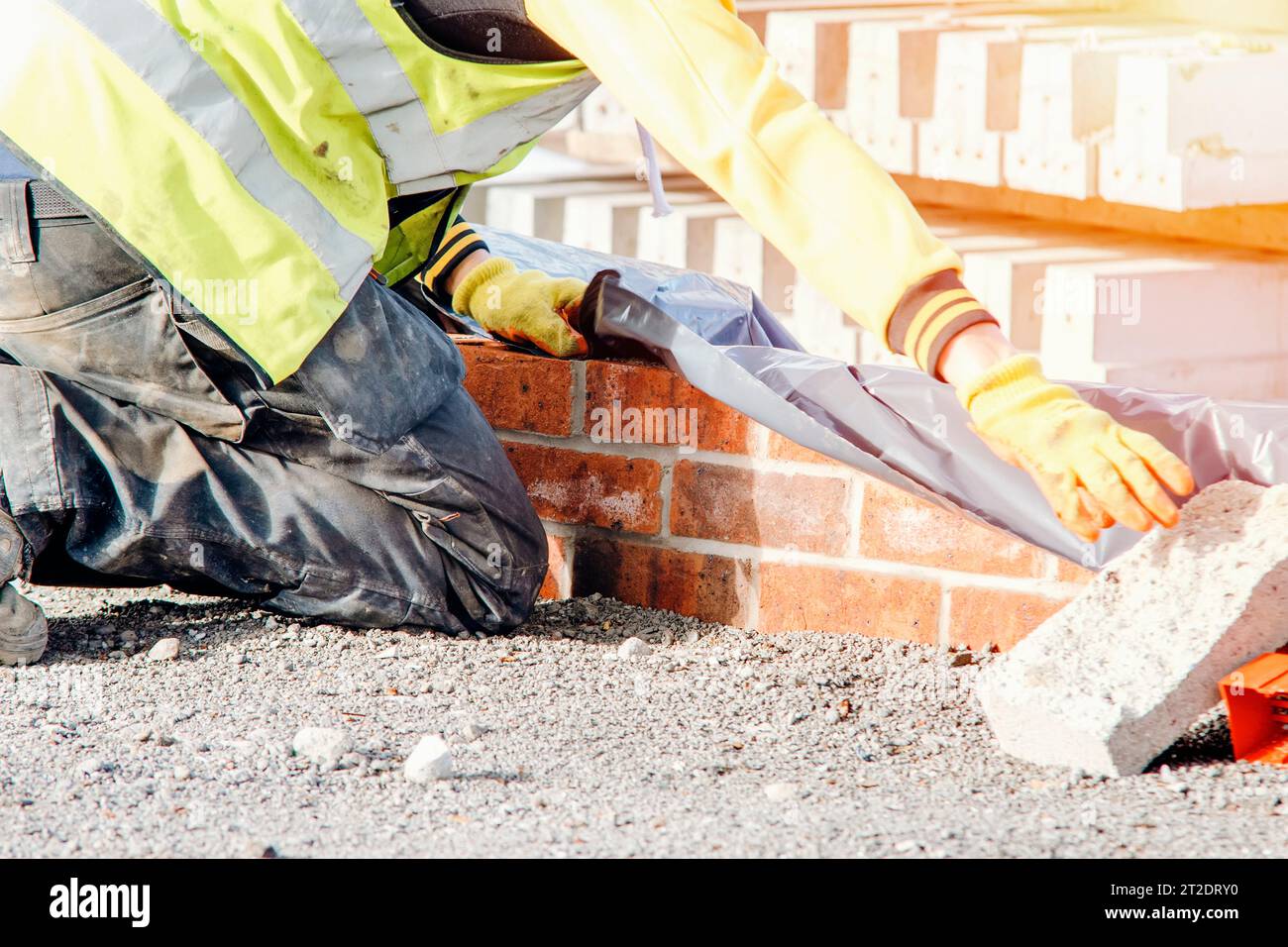 Ground floor waterproofing membrane installation on new house close-up ...