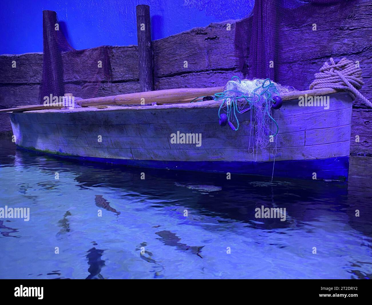 Wood Skiff Tied At Dock with Flemish Coil Beside Cleat Stock Photo - Alamy