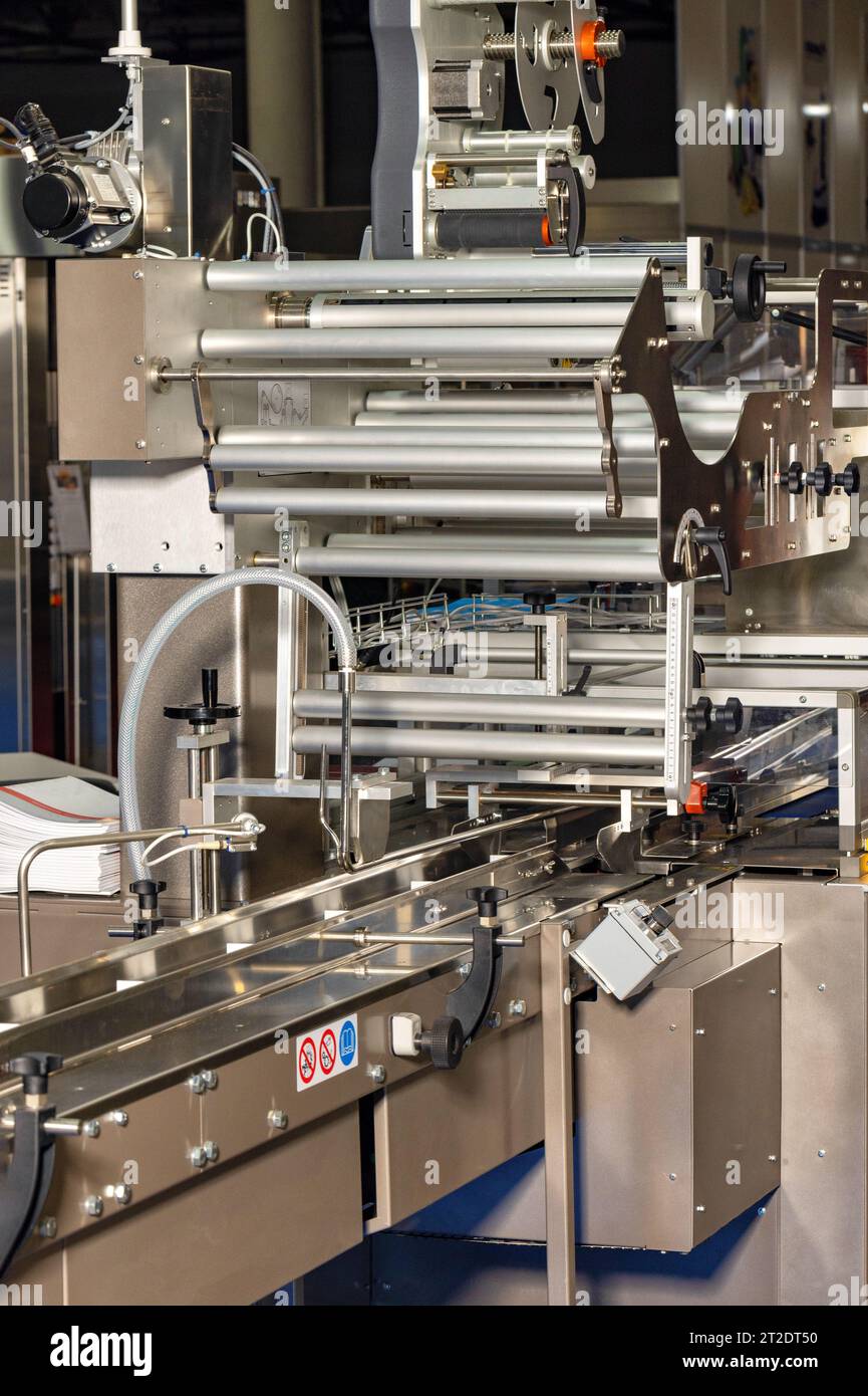 Industrial automatic packaging conveyor line made of stainless steel in a food factory Stock ...