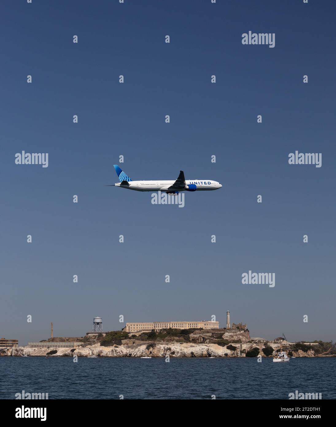 United Airlines Boeing 777 flying low over Alcatraz Island in San ...
